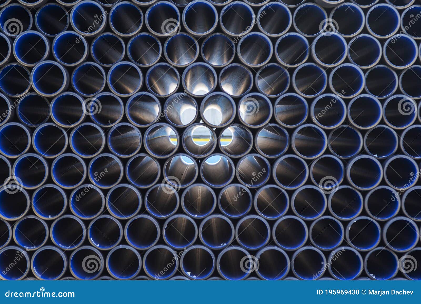 Stacked pipes perspective stock photo. Image of drainage - 195969430