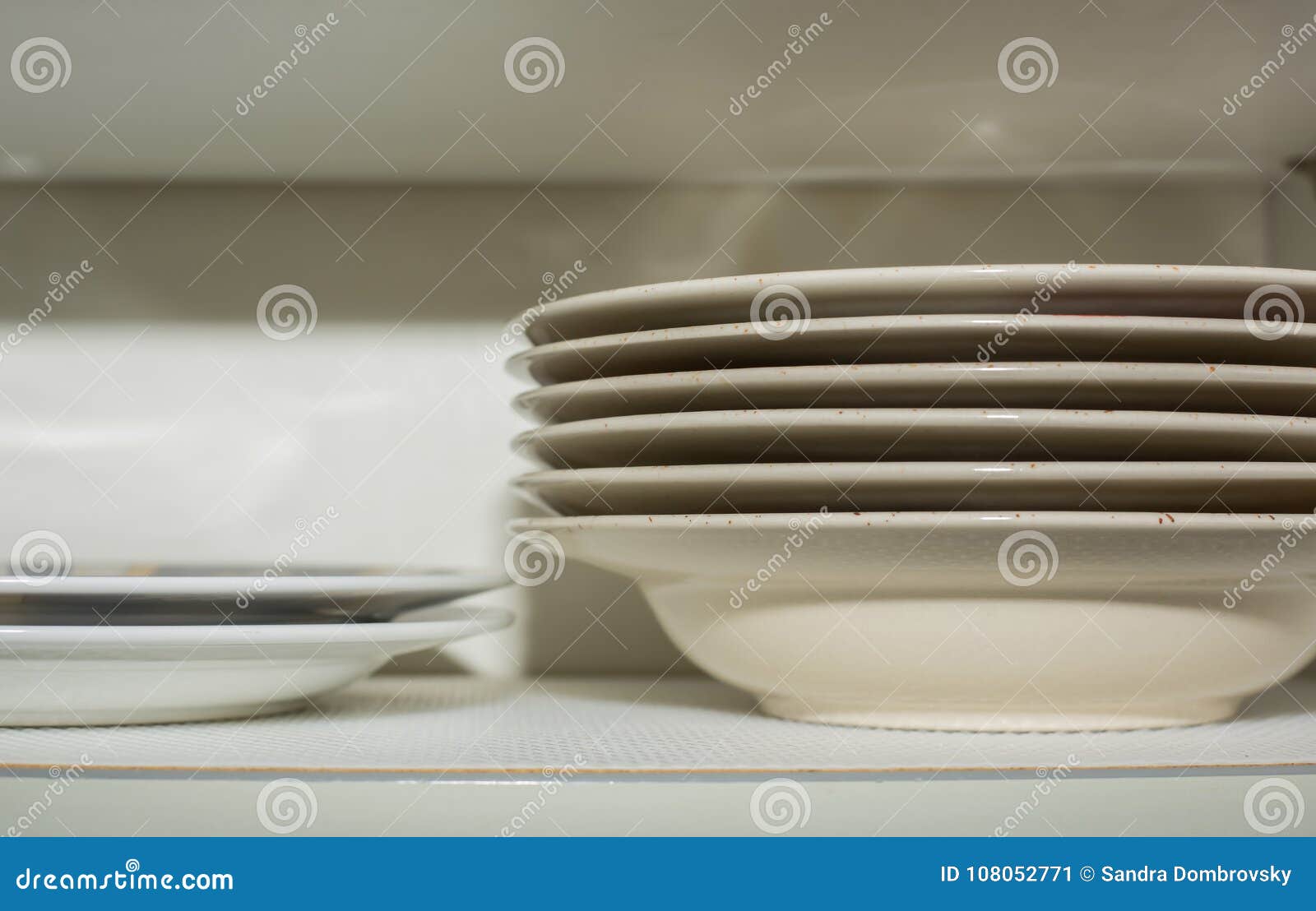 Stacked Plates in the Kitchen Cupboard Stock Image - Image of table ...