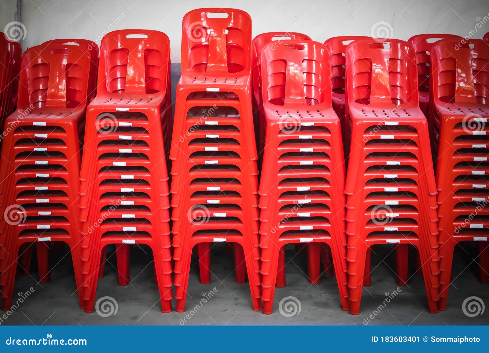 Stacked Red Plastic Chairs in Rows Stock Image - Image of stacked ...