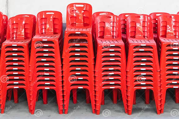 Stacked Red Plastic Chairs in Rows Stock Image - Image of pattern ...