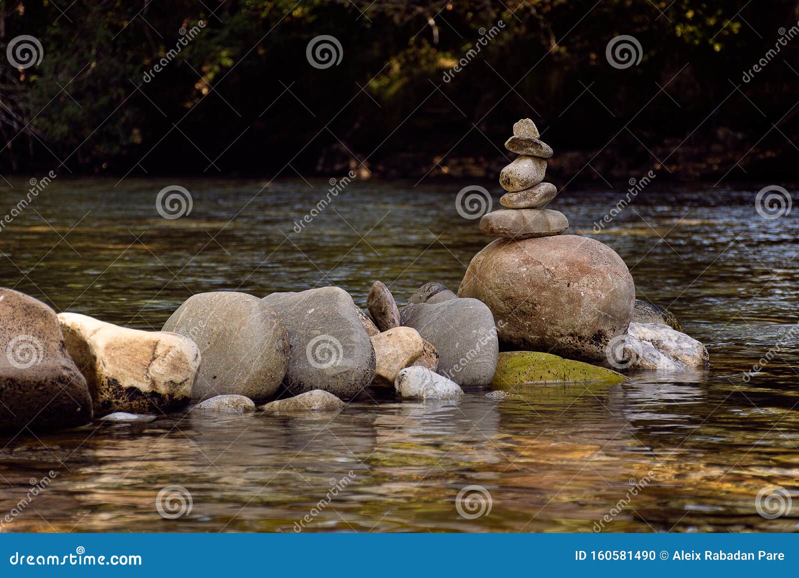 Stacked rocks in a river stock photo. Image of fresh - 160581490
