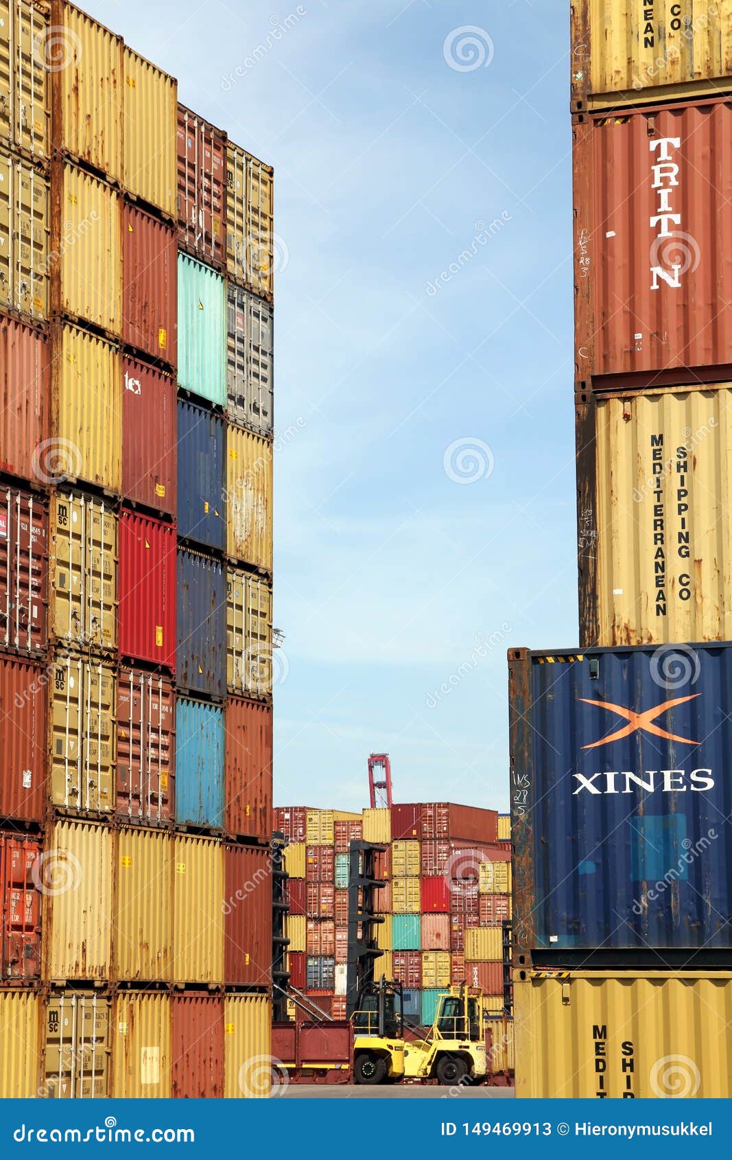 Stacked Shipping Containers and Empty Container Handler Editorial Stock ...