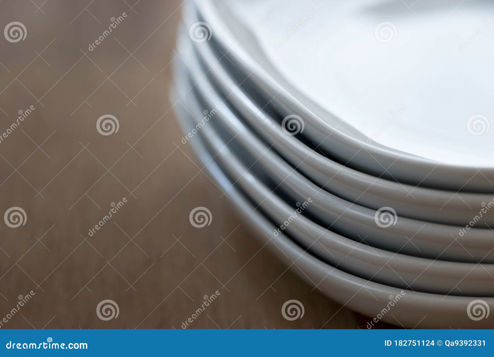 Stacked Square Plates on Wooden Brown Background. Stack Pile of ...