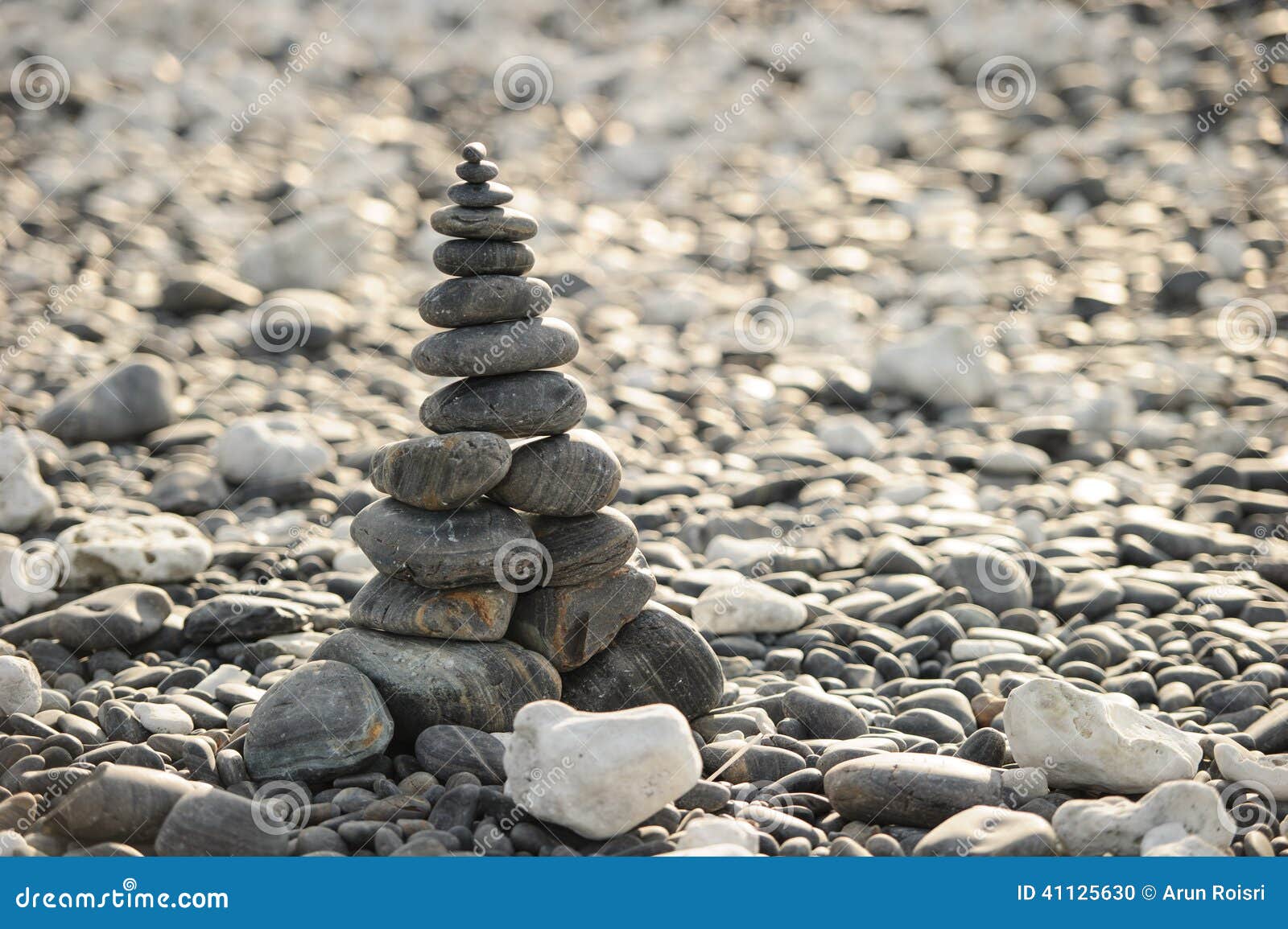 Stacked Stones on a Background of Beach Stock Photo - Image of sign ...