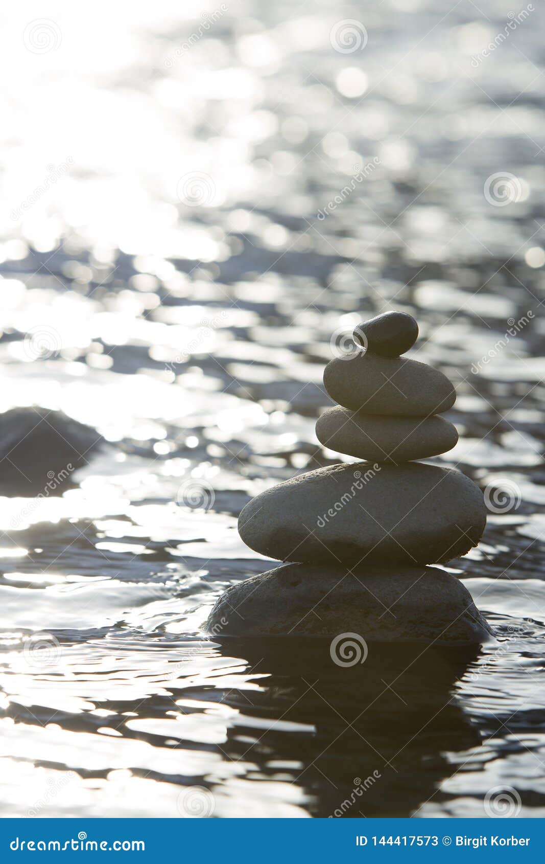 Stacked stones in water stock image. Image of balance - 144417573