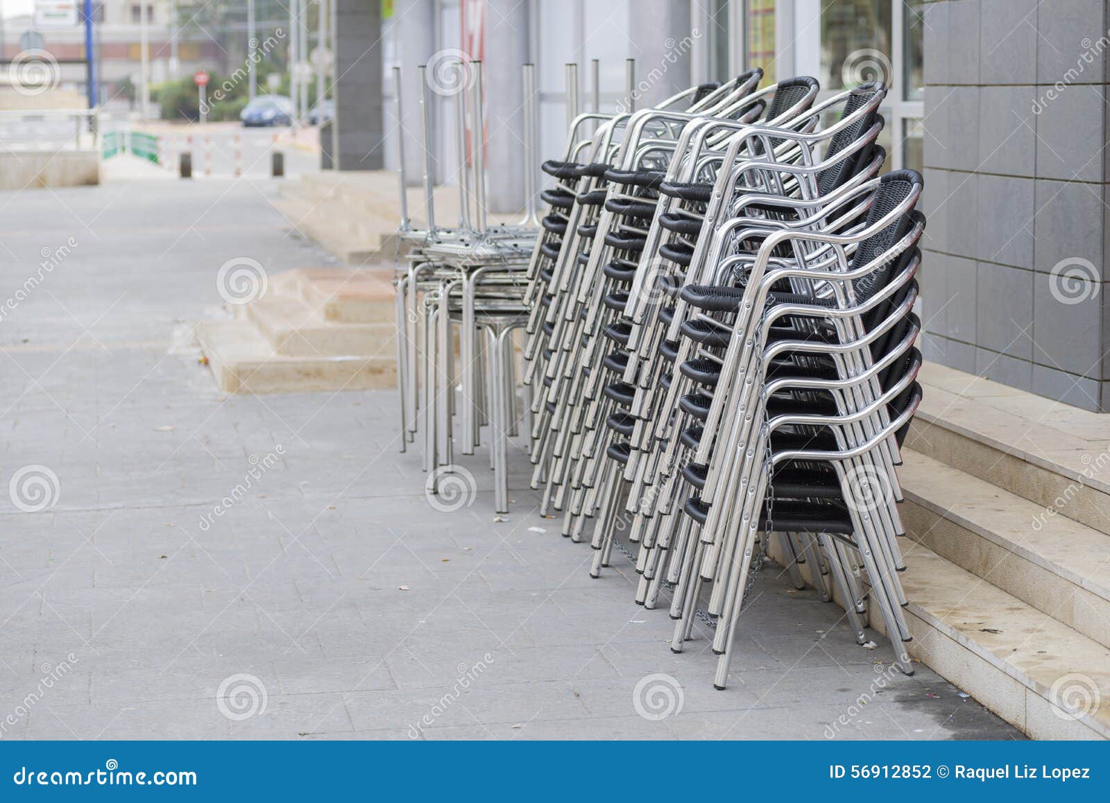 Stacked tables and chairs. stock photo. Image of bartender - 56912852