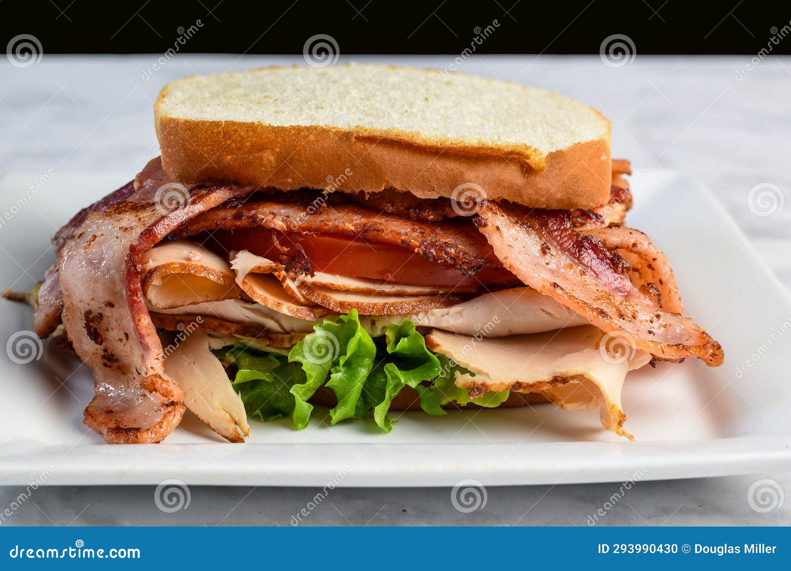 A Stacked Turkey Bacon Tomato Sandwich Stock Photo - Image of meat ...