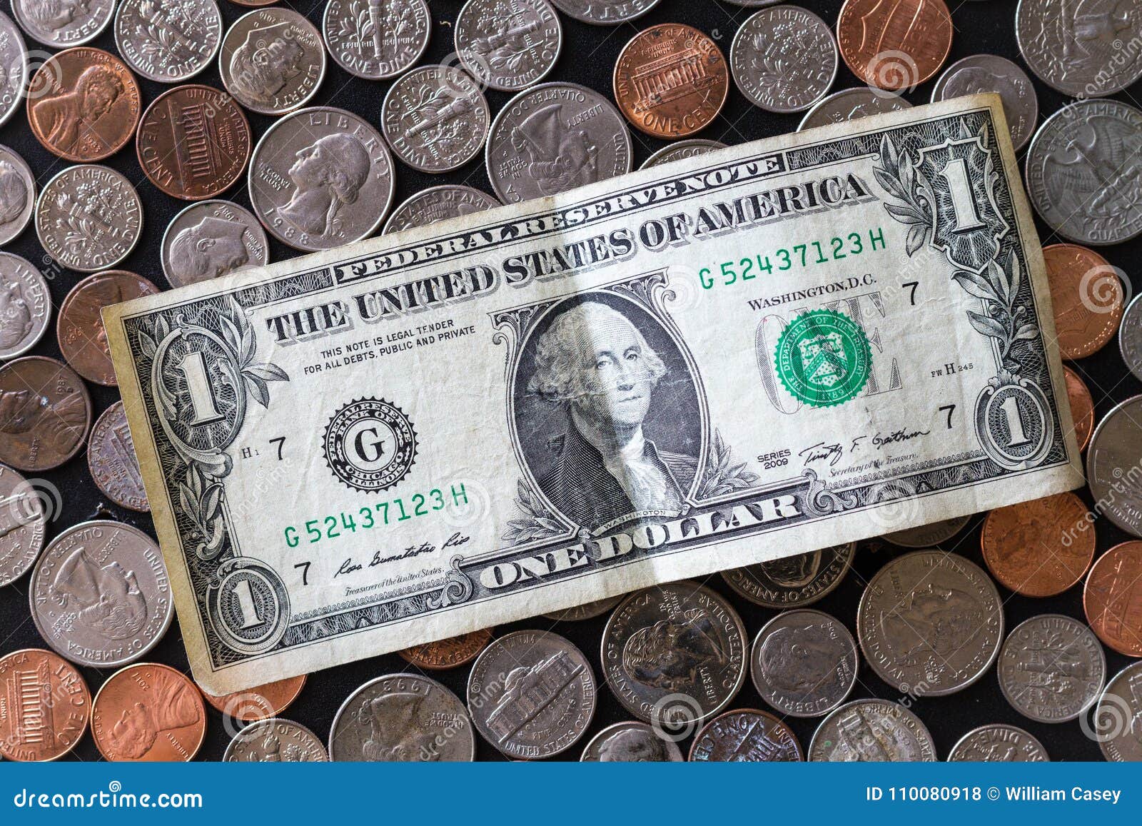 Stacked US Coins Surrounded by Coins and Paper Rolls Stock Photo ...