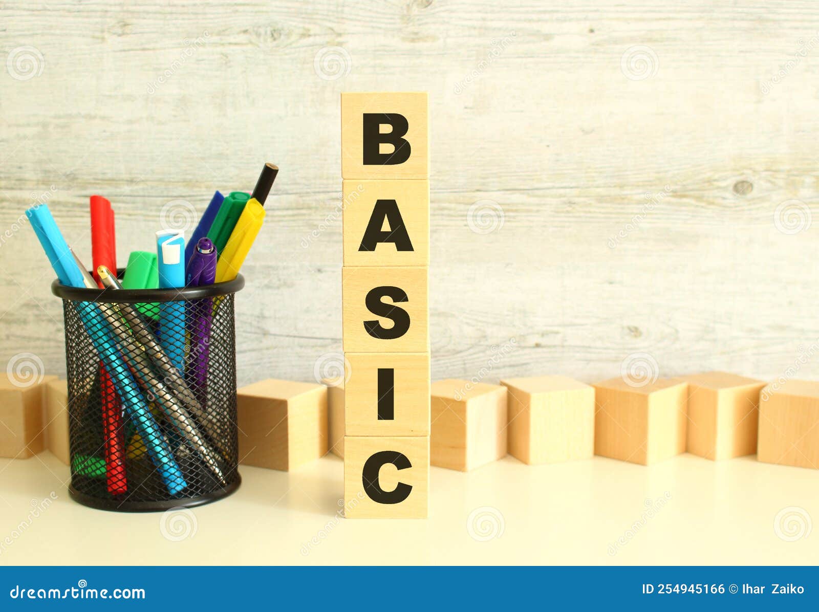 Stacked Vertically Wooden Cubes with Letters in the Word BASIC on a ...