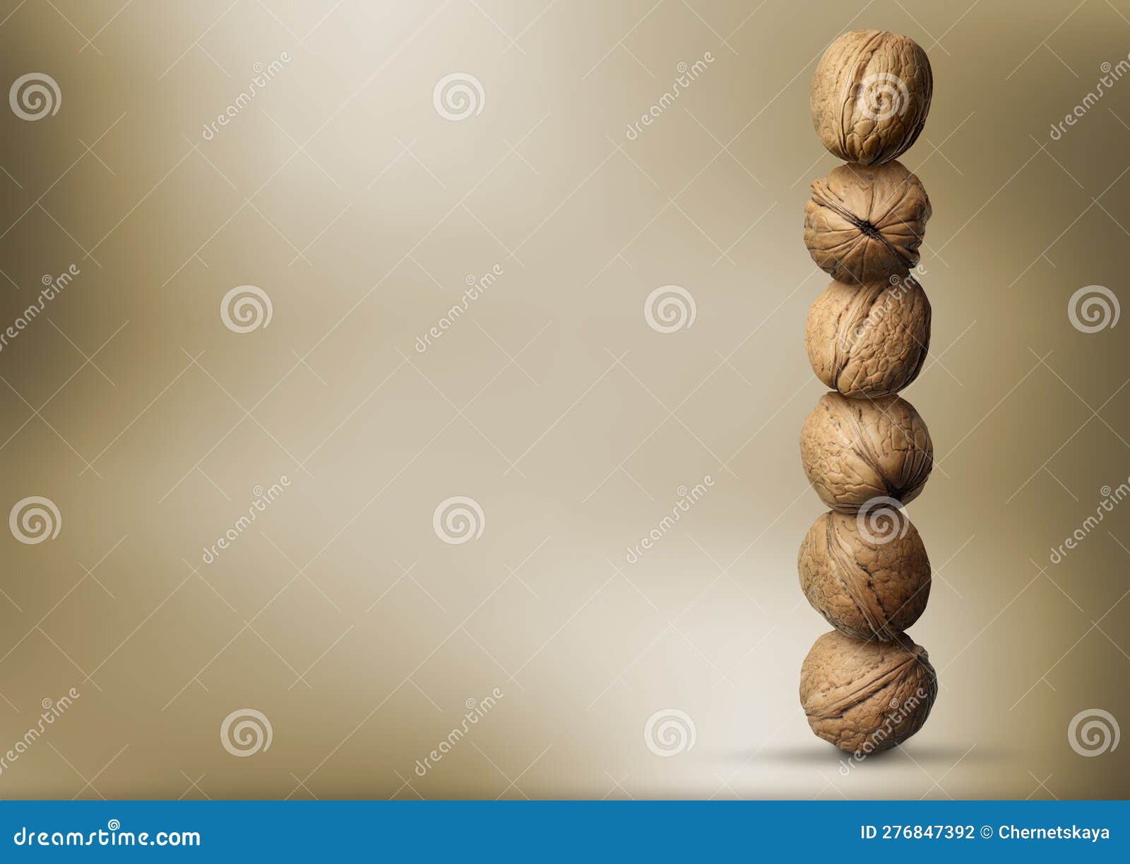 Stacked Walnuts on Light Brown Gradient Background, Space for Text ...