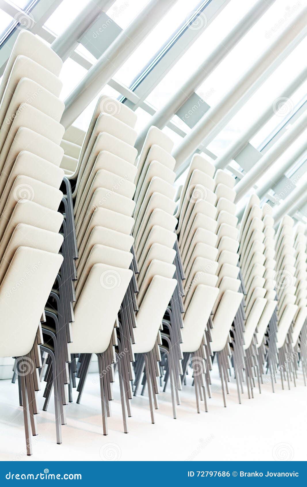 Stacked white chairs stock photo. Image of empty, background - 72797686