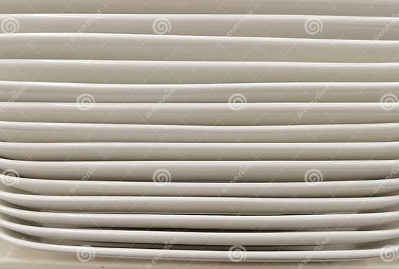 Stacked White Plates in One Direction Stock Photo - Image of office ...