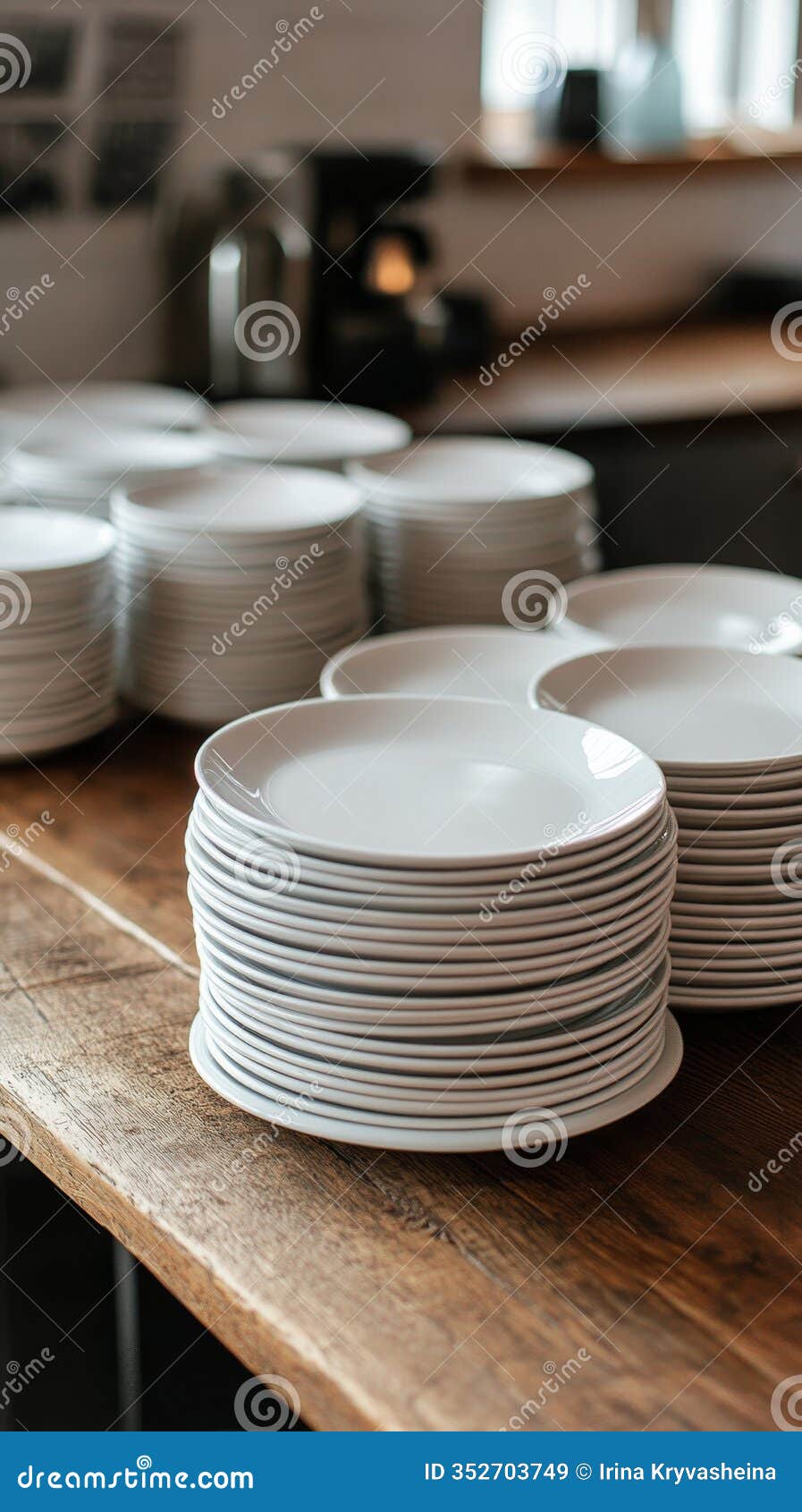 Stacked White Plates on Wooden Table in a Rustic Environment Stock ...