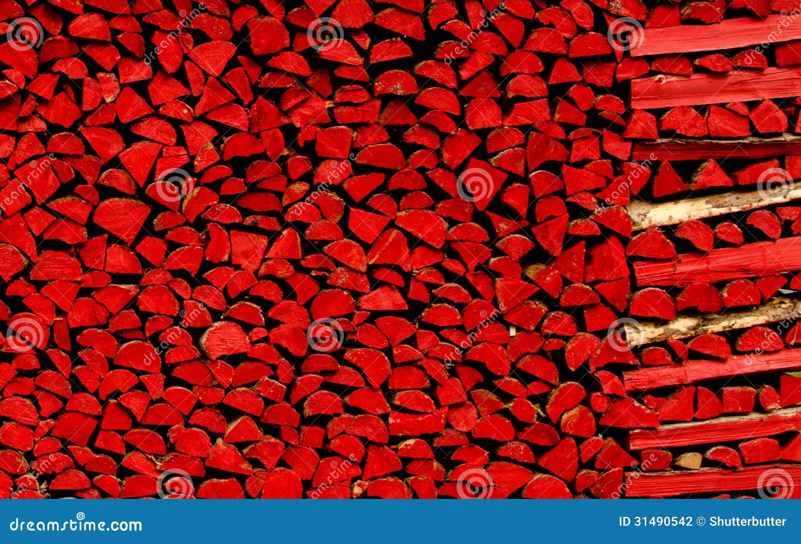 Stacked wood painted red stock photo. Image of paint - 31490542