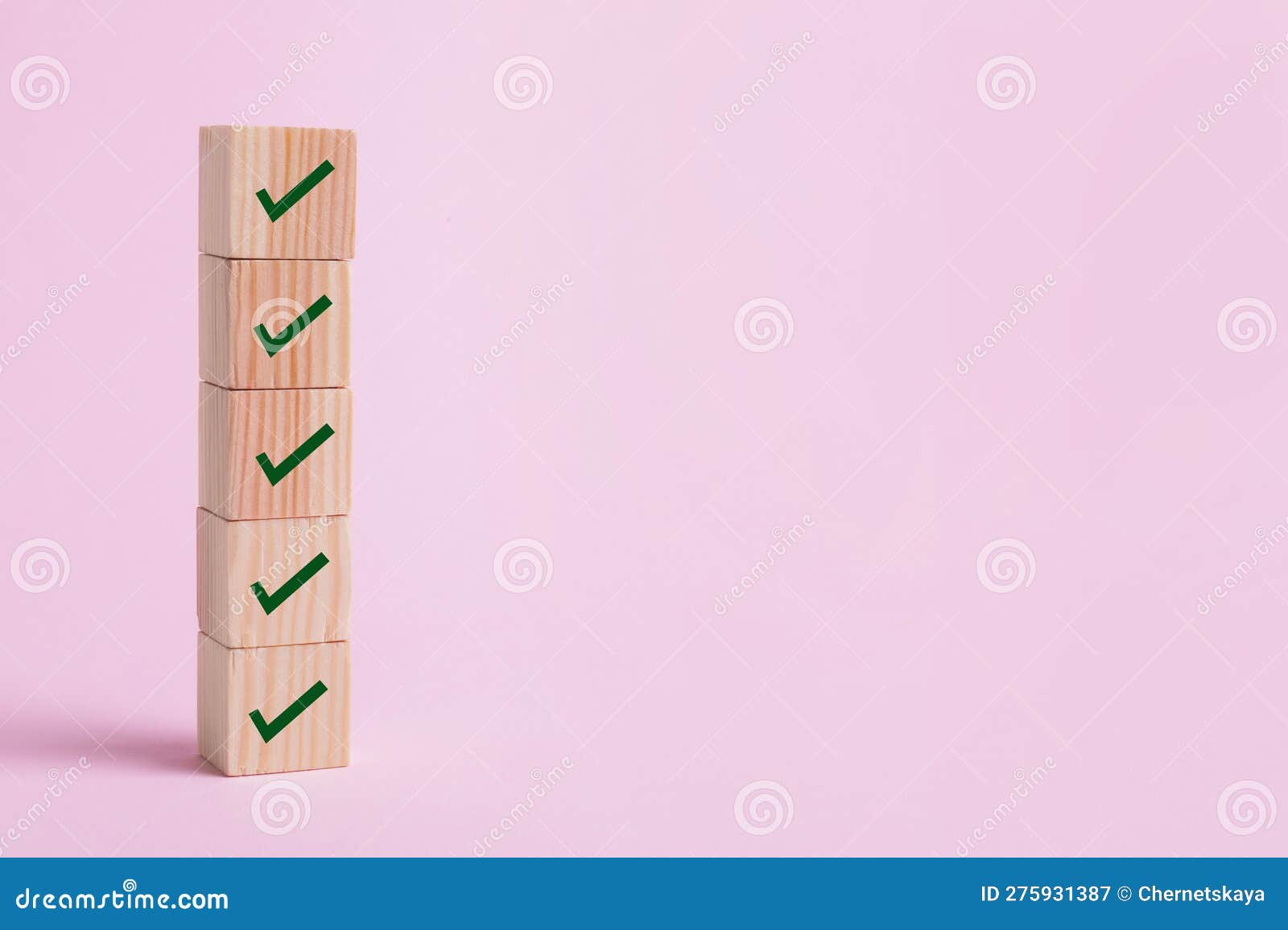 Stacked Wooden Cubes with Check Marks on Pale Pink Background. Space ...