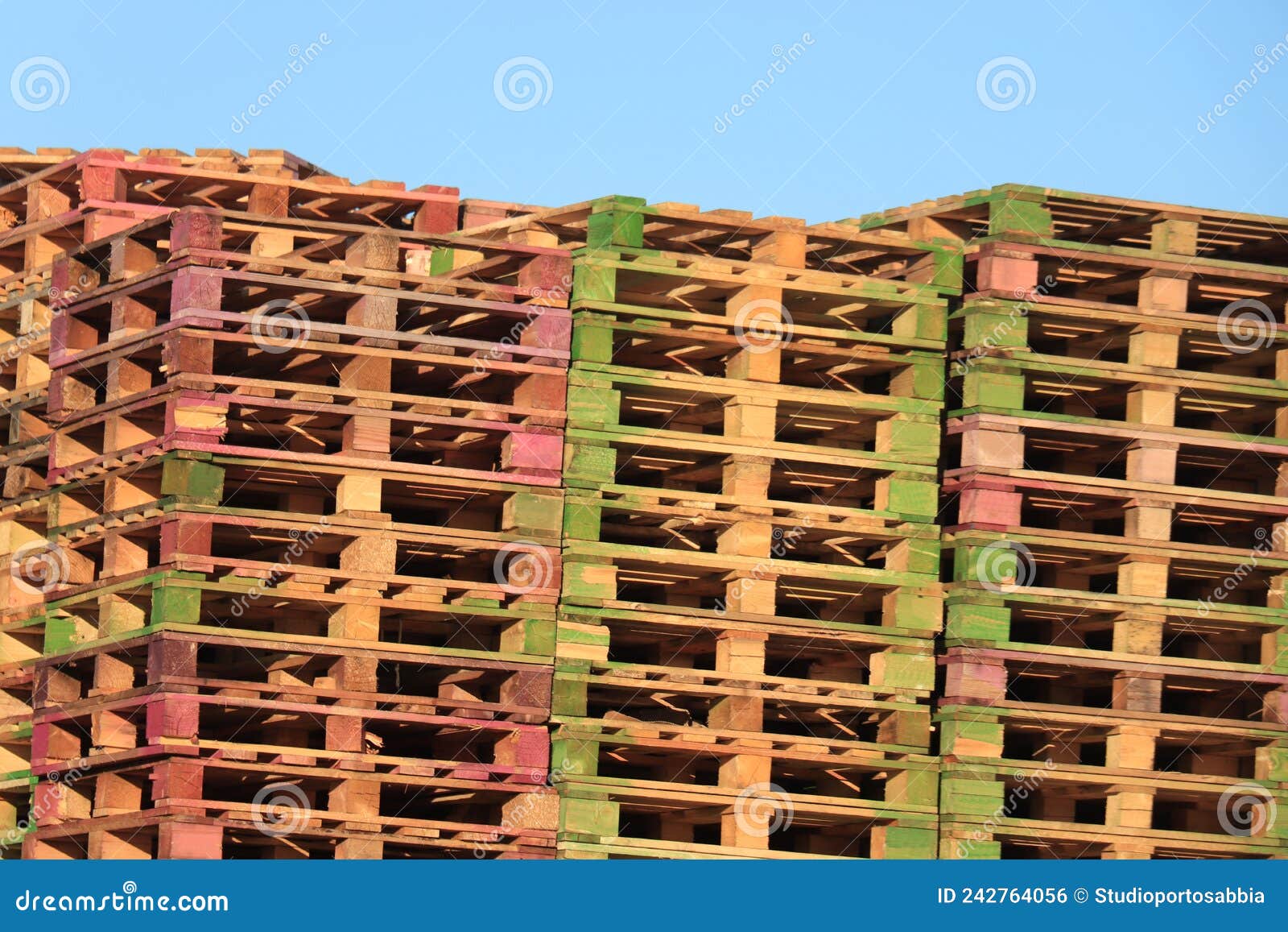 Stacked wooden pallets stock photo. Image of pallets - 242764056
