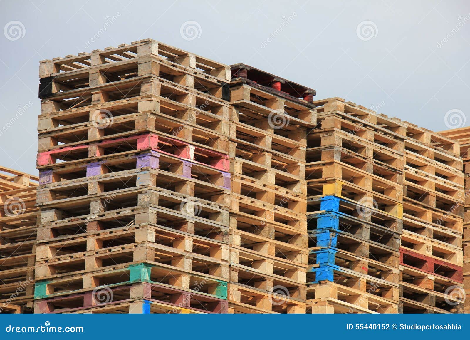 Stacked wooden pallets stock photo. Image of pile, warehouse - 55440152