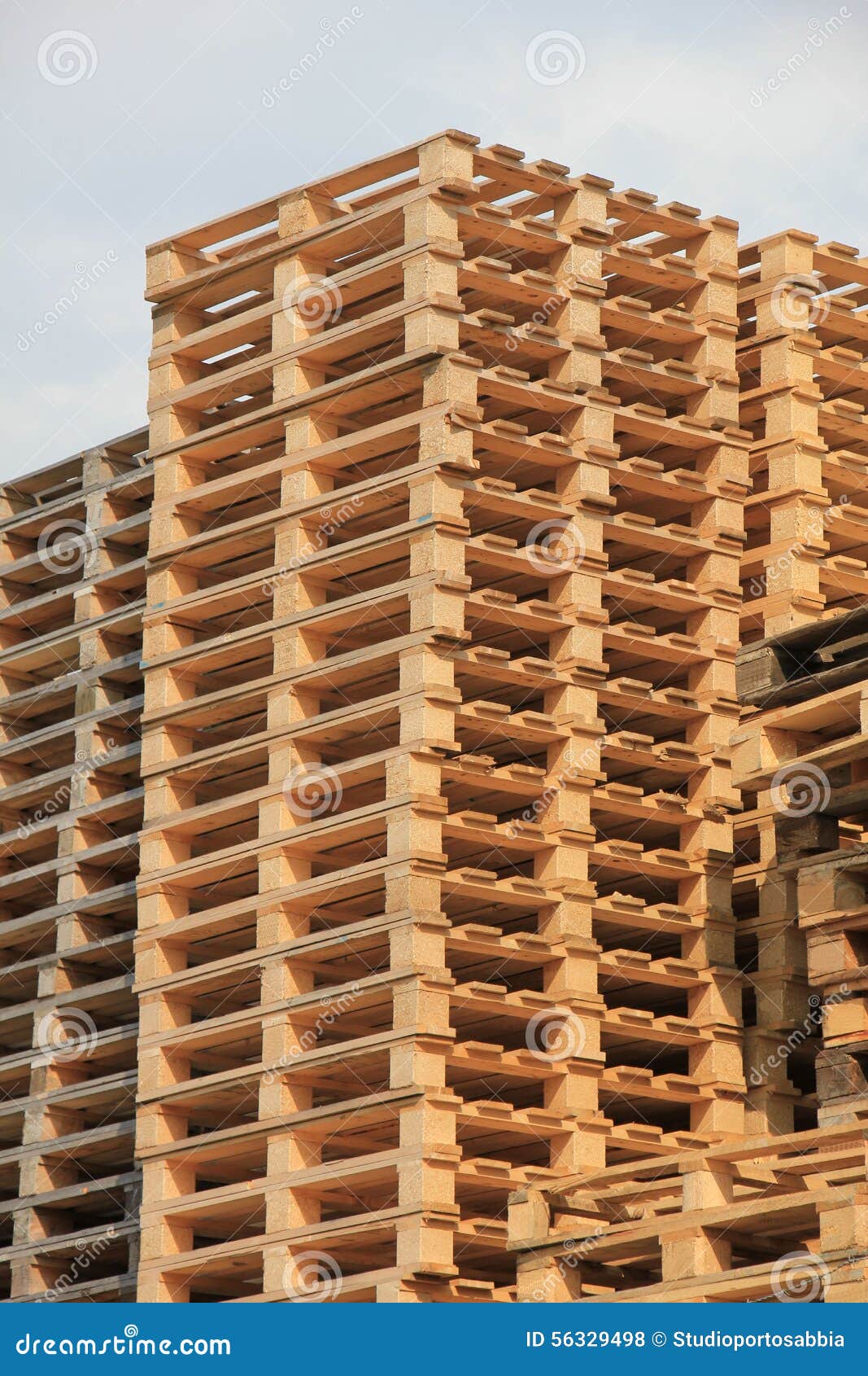 Stacked wooden pallets stock photo. Image of transport - 56329498