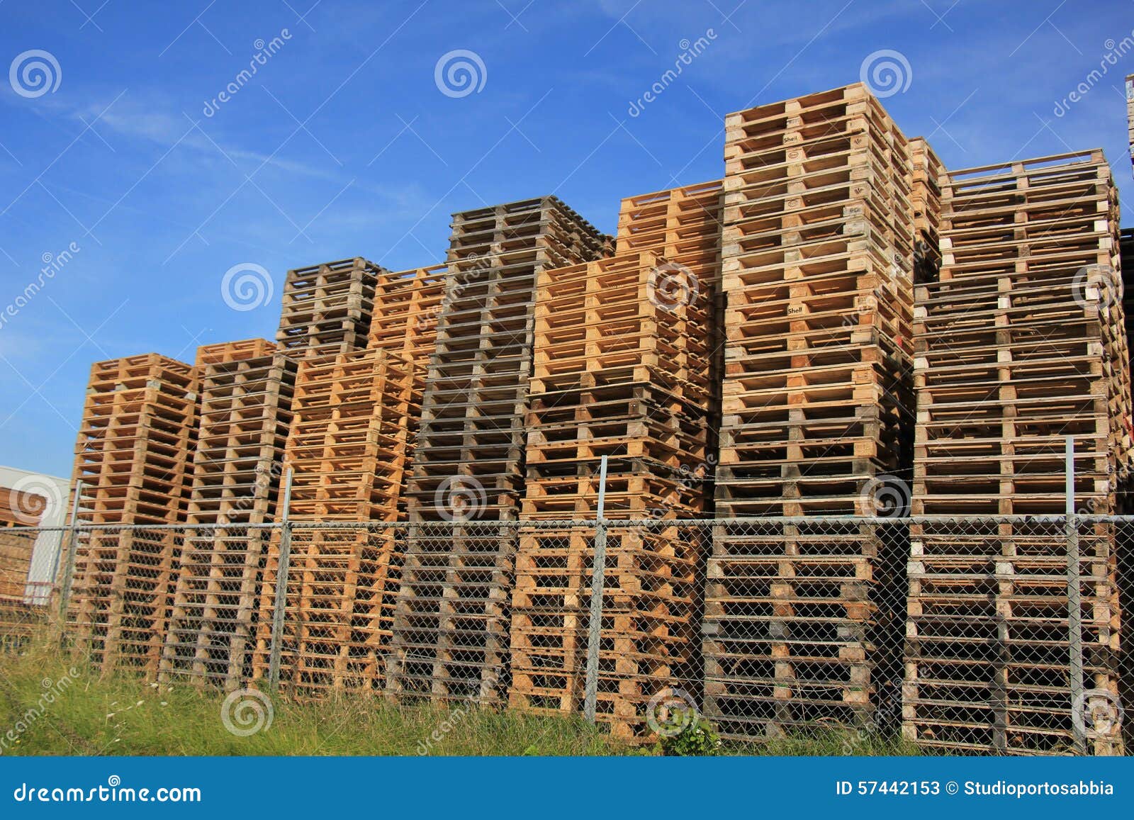 Stacked wooden pallets stock image. Image of blue, storage - 57442153