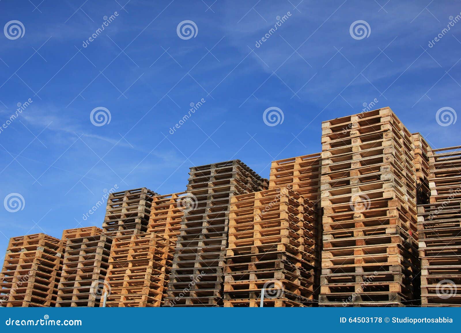 Stacked wooden pallets stock photo. Image of brick, shipping - 64503178