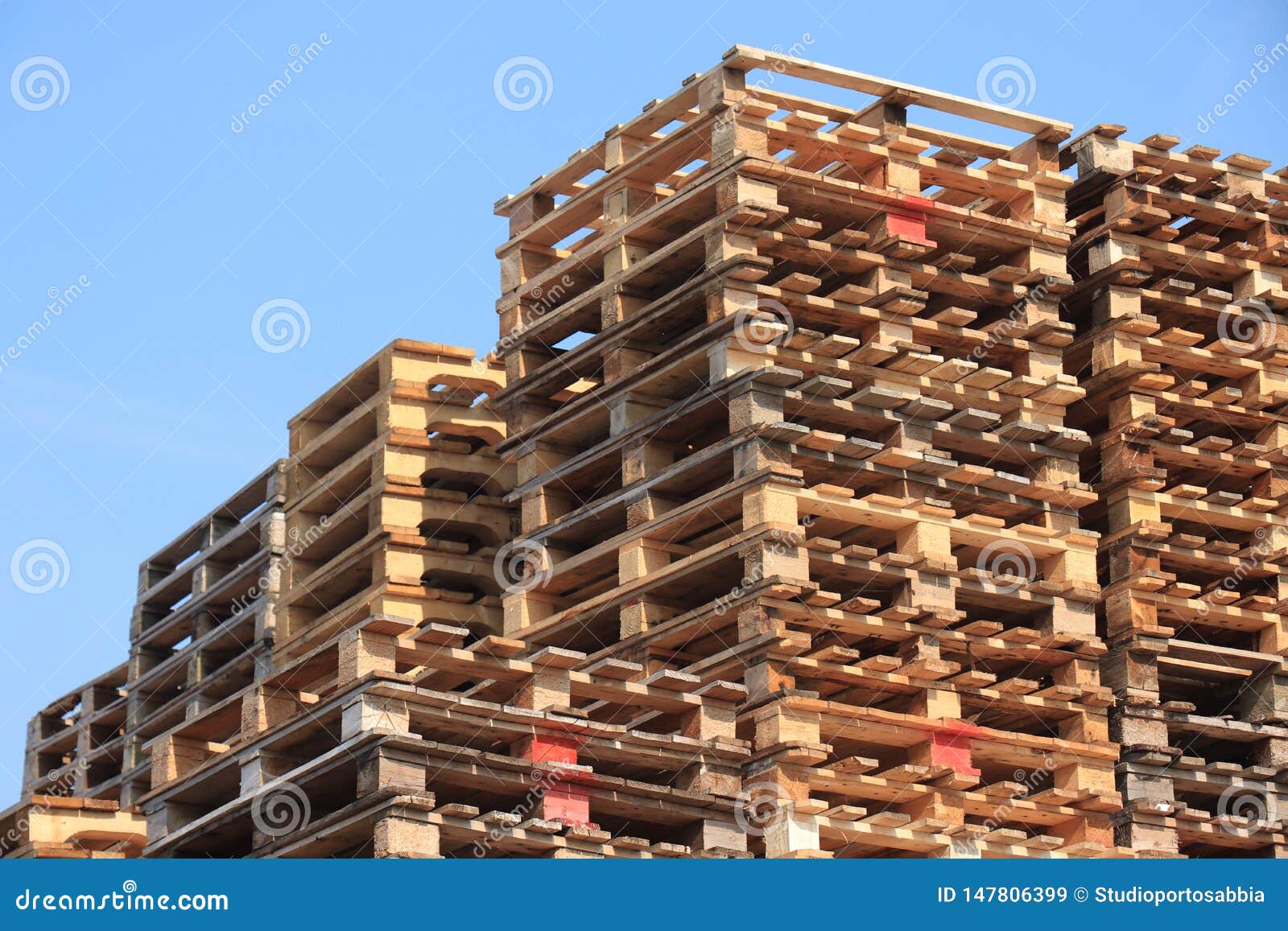 Stacked wooden pallets stock image. Image of transportation - 147806399
