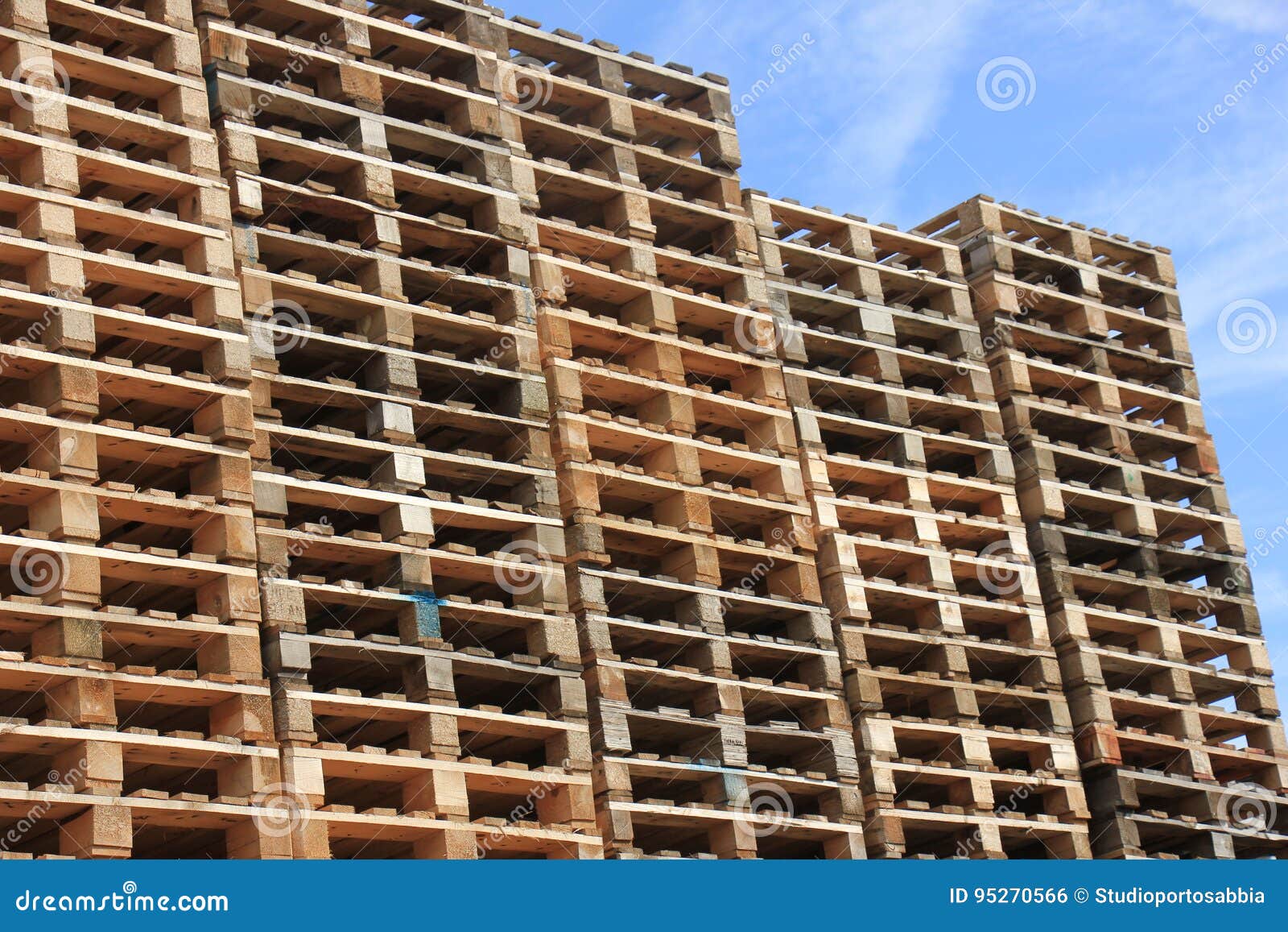 Stacked wooden pallets stock photo. Image of warehouse - 95270566