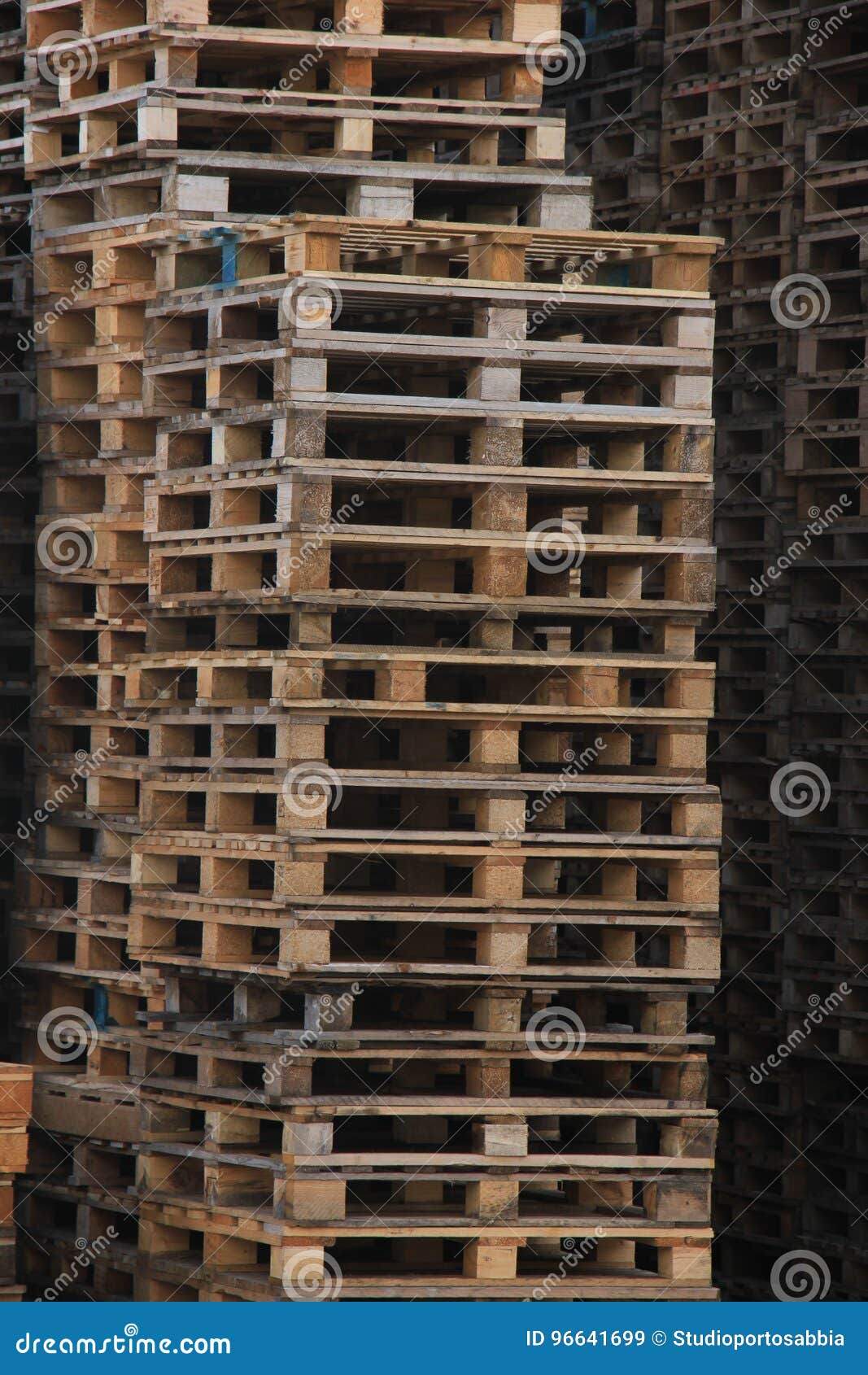 Stacked wooden pallets stock image. Image of business - 96641699