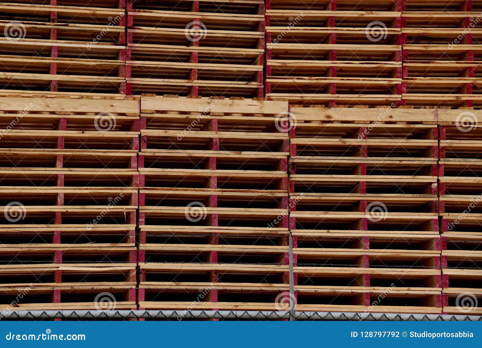 Stacked wooden pallets stock photo. Image of wood, package - 128797792