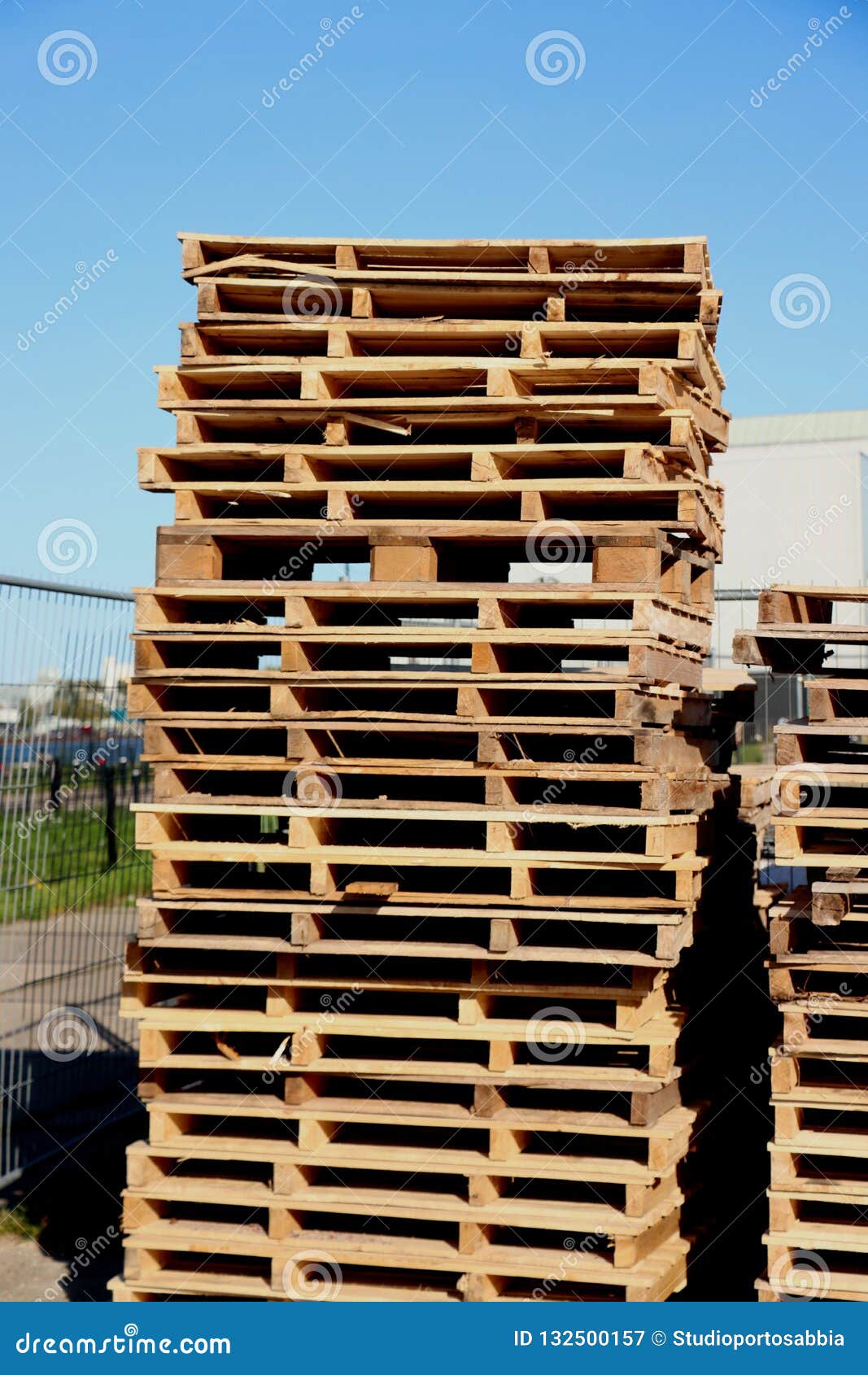 Stacked wooden pallets stock image. Image of industrial - 132500157
