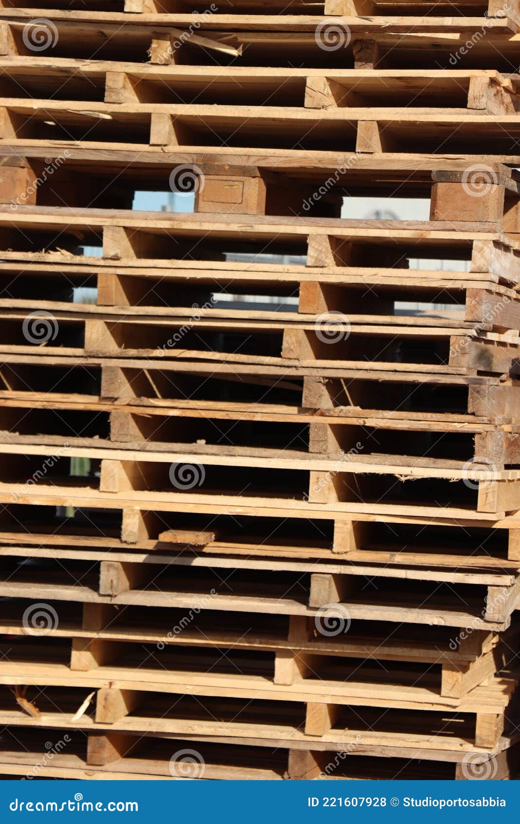 Stacked wooden pallets stock photo. Image of storage - 221607928