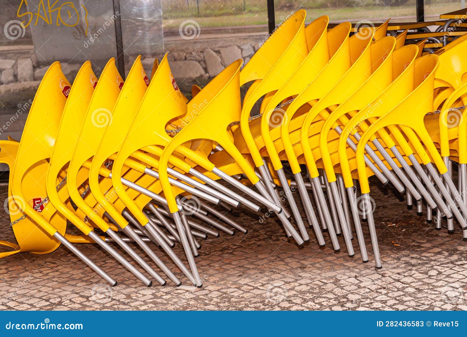 Stacked, Yellow, Plastic Chairs, at a Restaurant, on Canal Bank in ...