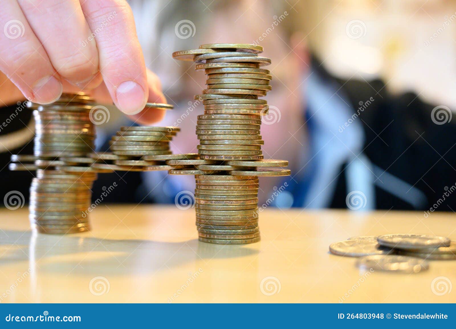 Stacking Gold Dollar Coins into Bridge Using a Cantilever Stock Photo ...
