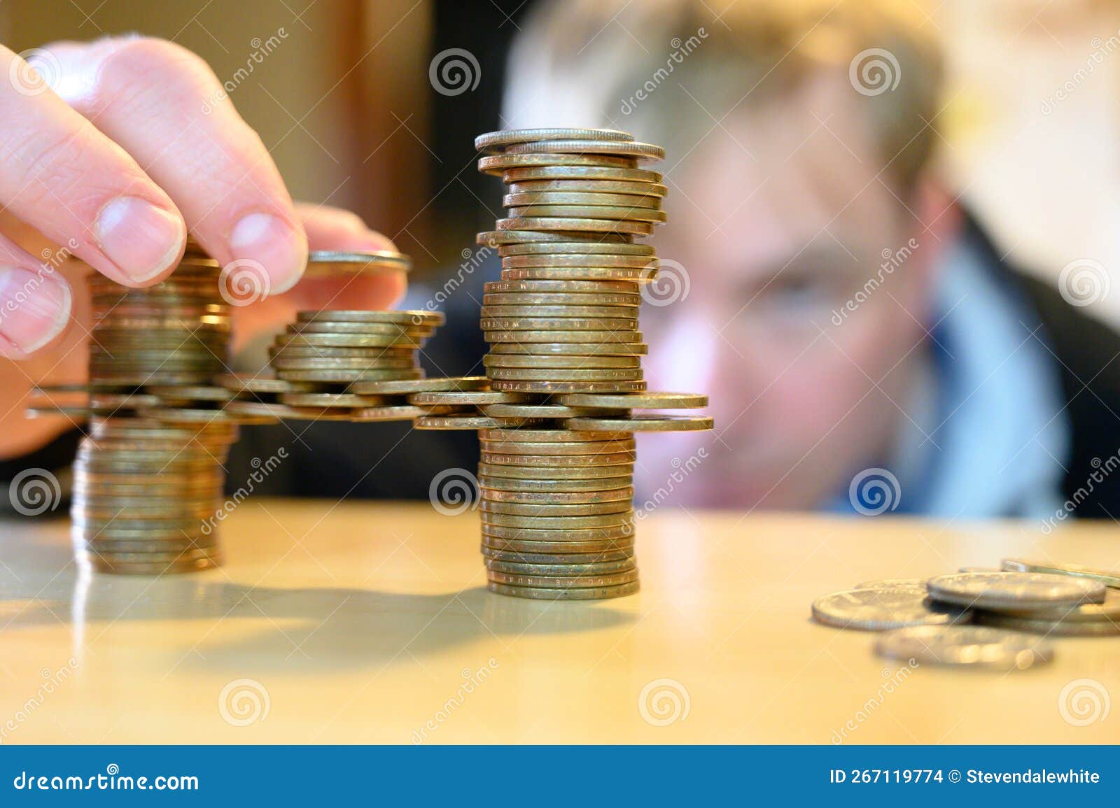 Stacking Gold Dollar Coins into Bridge Using a Cantilever Stock Photo ...