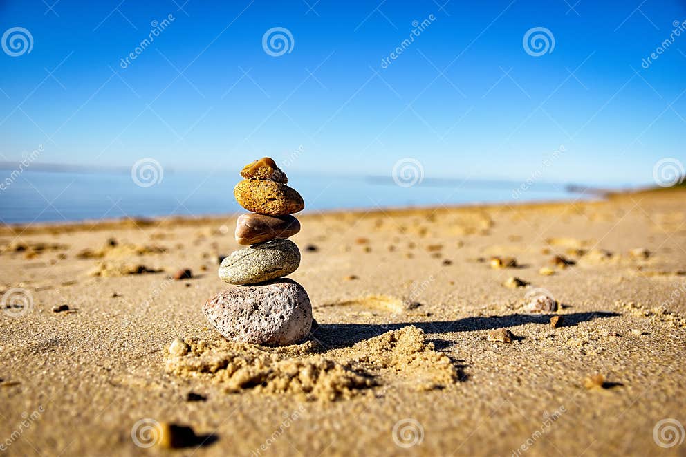 Stacking Stones by the Sea in Autumn Stock Image - Image of stone, blue ...