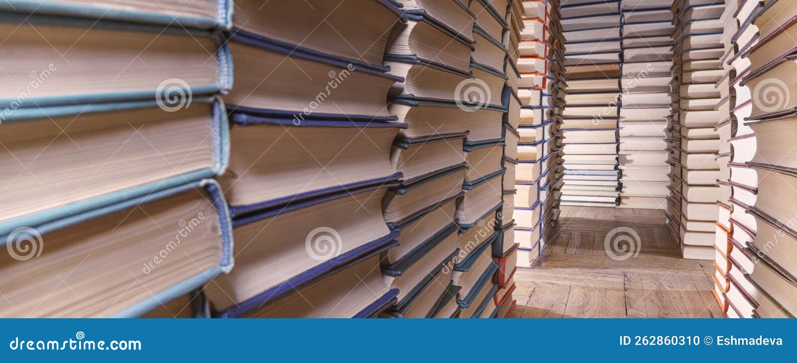 Stacks of Books in the Form of a Long Corridor on the Old Parquet Floor ...