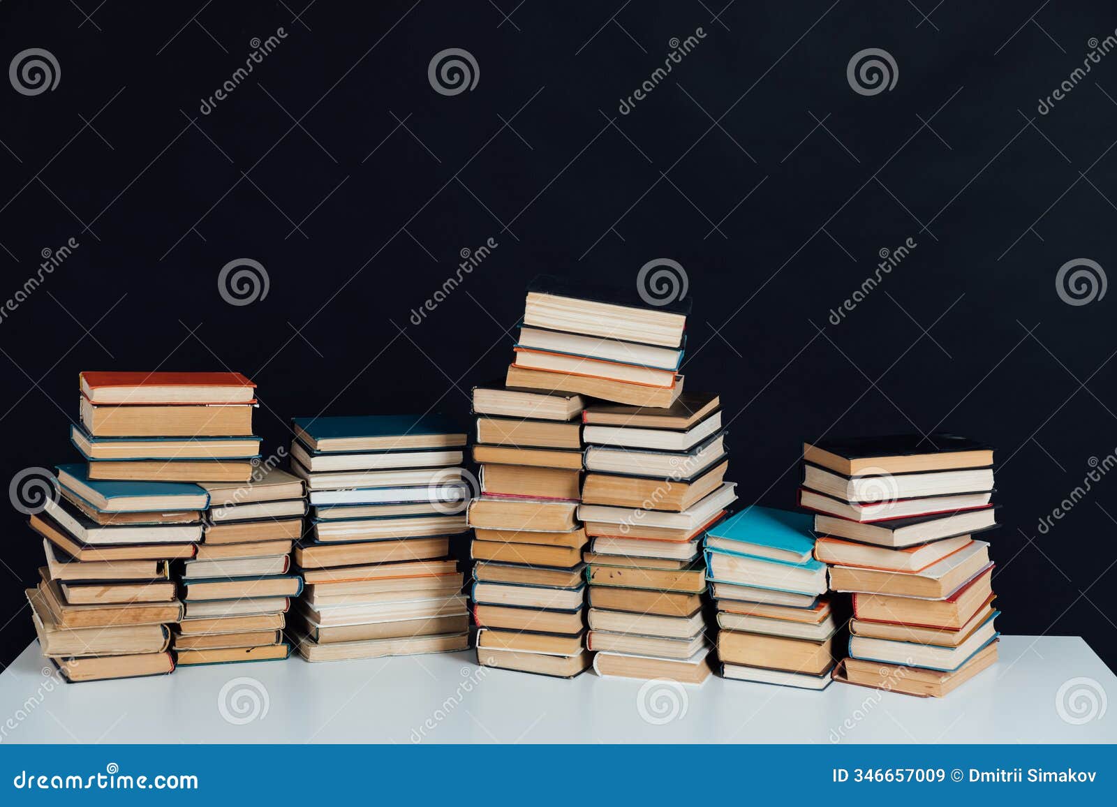 Stacks of Books for Reading and Education in College Library on Black ...