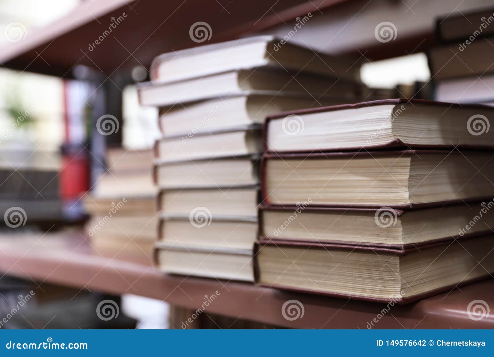 Stacks of books on shelf stock photo. Image of literary - 149576642