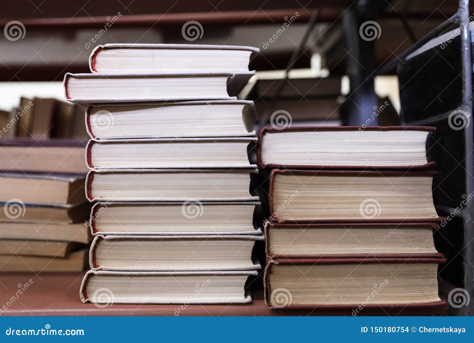 Stacks of books on shelf stock photo. Image of bookworm - 150180754