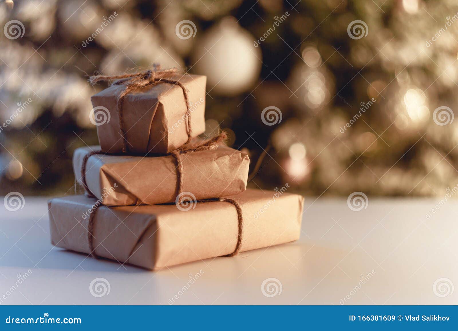 Stacks of Christmas Presents with Decorated Christmas Tree in ...