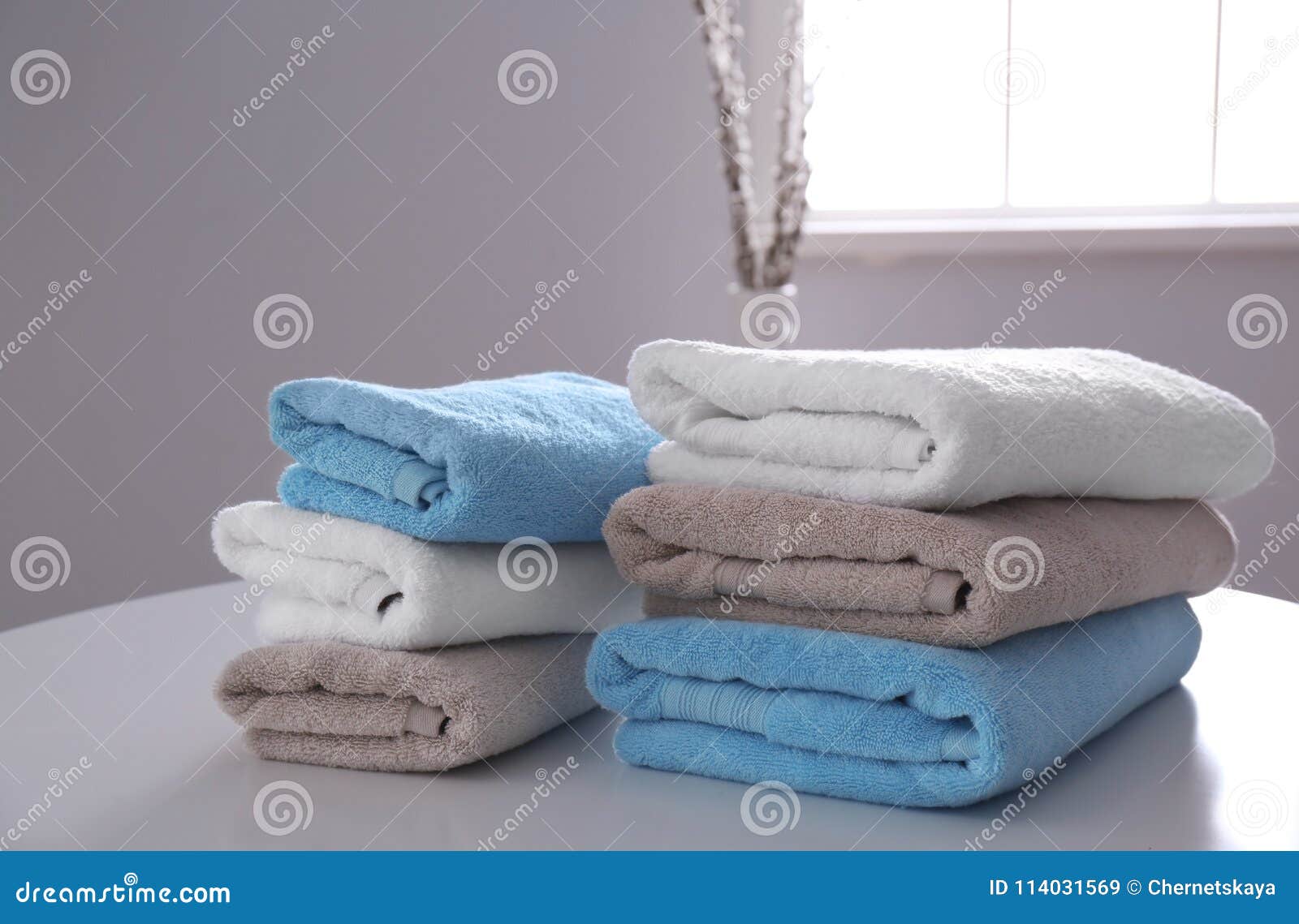 Stacks of Clean Towels on Table Stock Image - Image of fluffy, hygiene ...