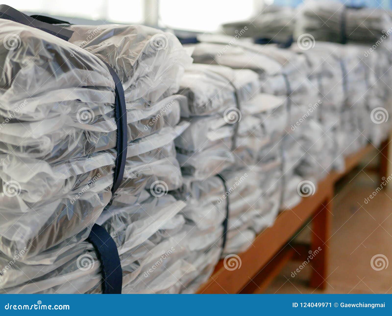 Stacks of Clothes Packed in Plastic Bags Ready To Be Shipped ...
