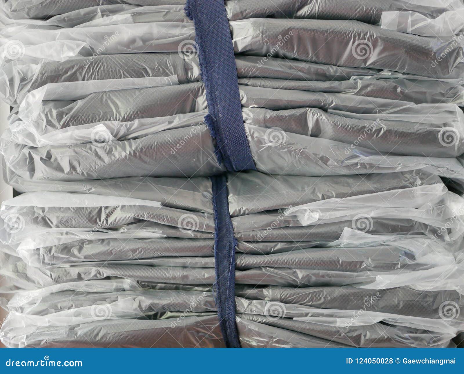 Stacks of Clothes Packed in Plastic Bags Ready To Be Shipped ...