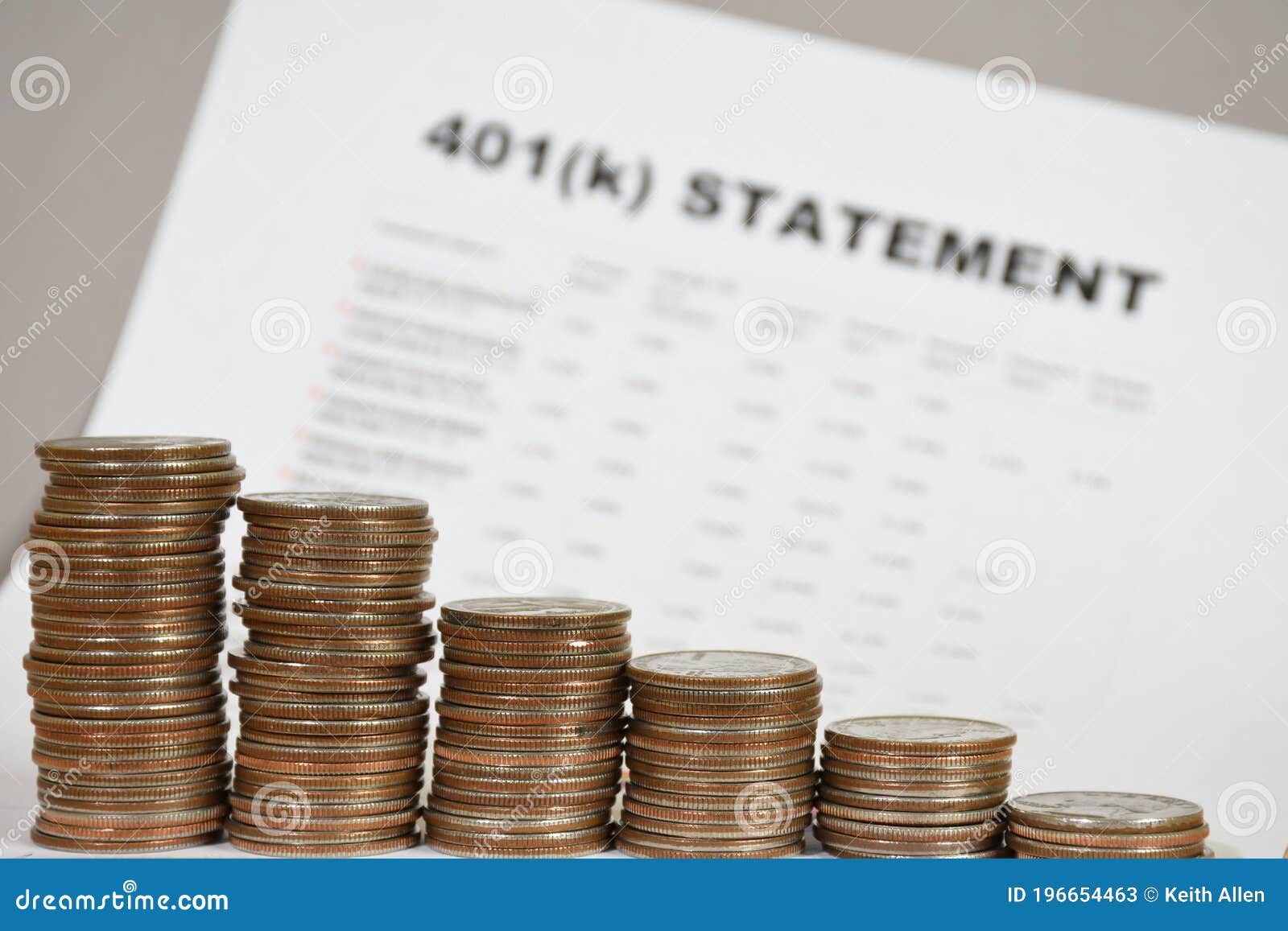 Stacks of Coin Money in a Descending Order in Front of a 401k Statement ...