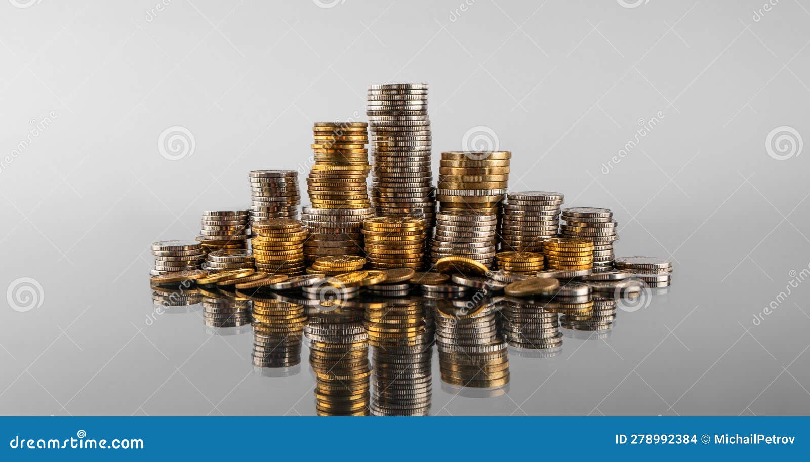Stacks of Coins in Reflection on a Grey Background Stock Photo - Image ...