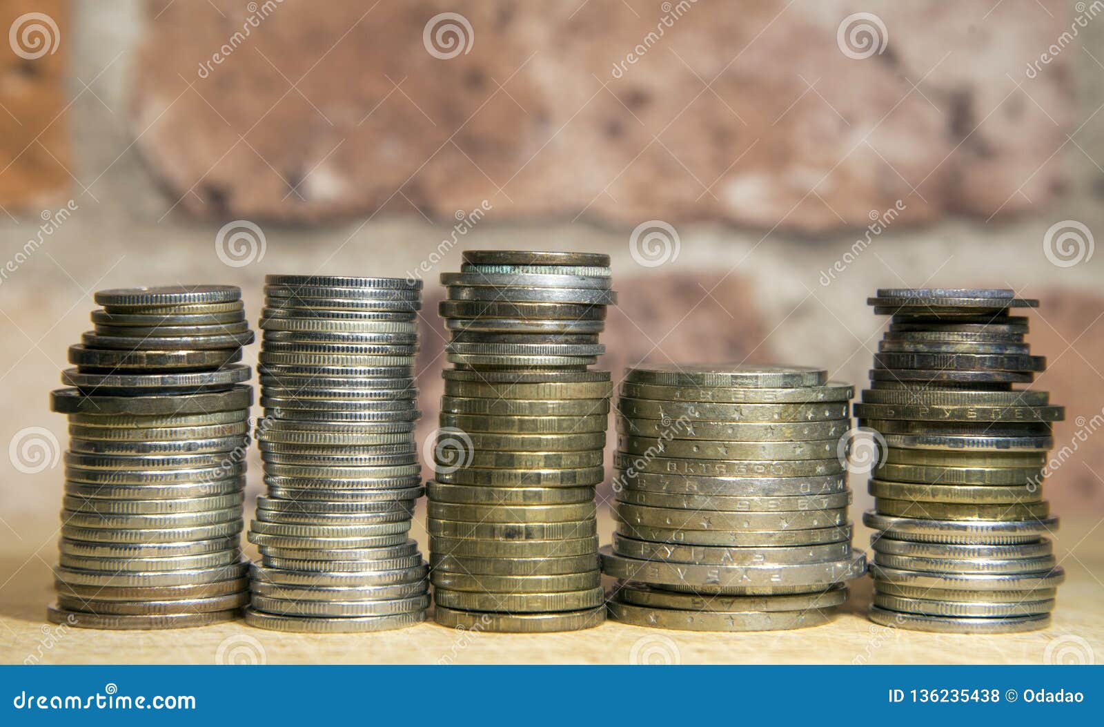 Stacks of Coins and a Vintage Brick Wall Stock Photo - Image of market ...