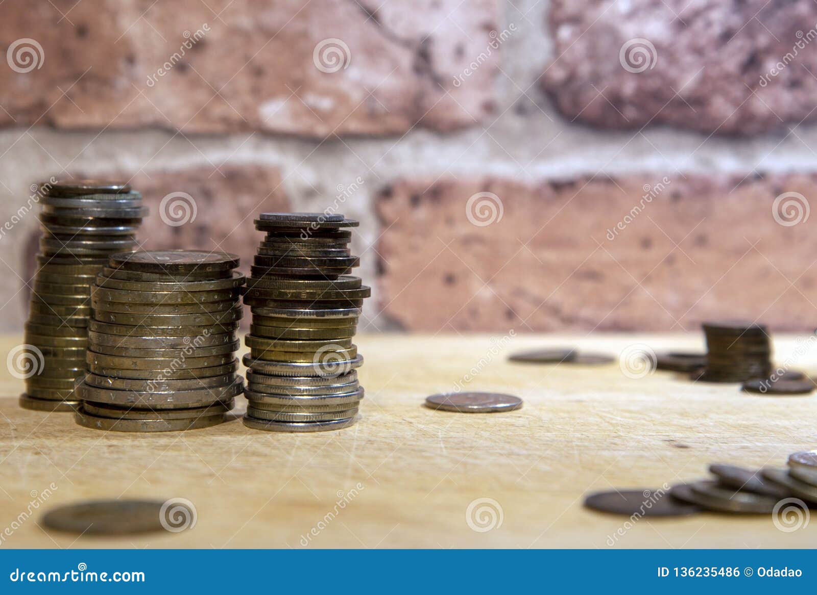 Stacks of Coins and a Vintage Brick Wall Stock Photo - Image of gold ...