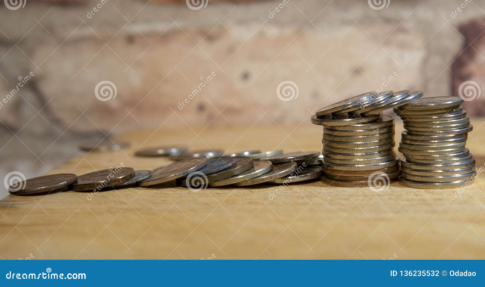 Stacks of Coins and a Vintage Brick Wall Editorial Photography - Image ...