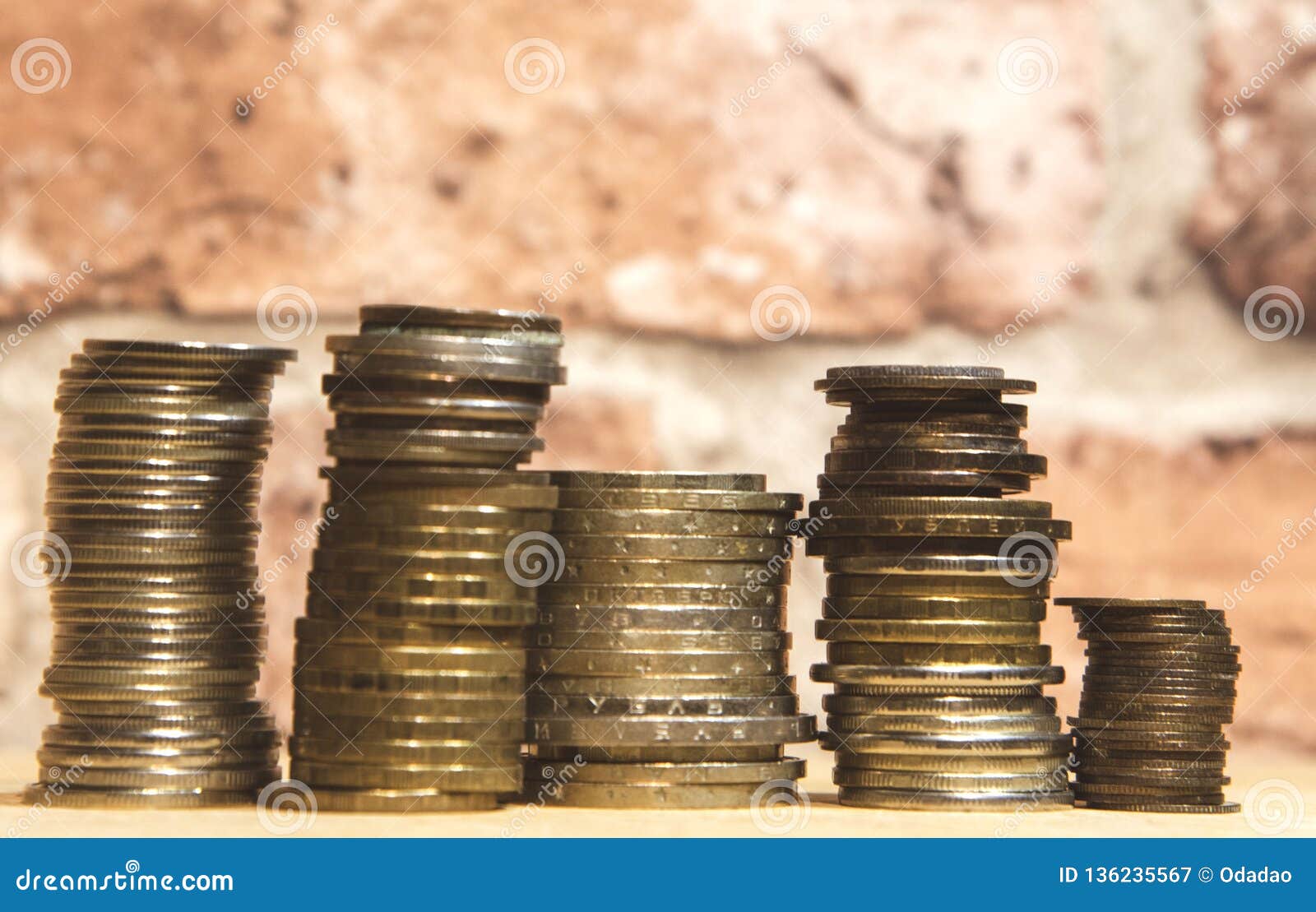 Stacks of Coins and a Vintage Brick Wall Editorial Photography - Image ...