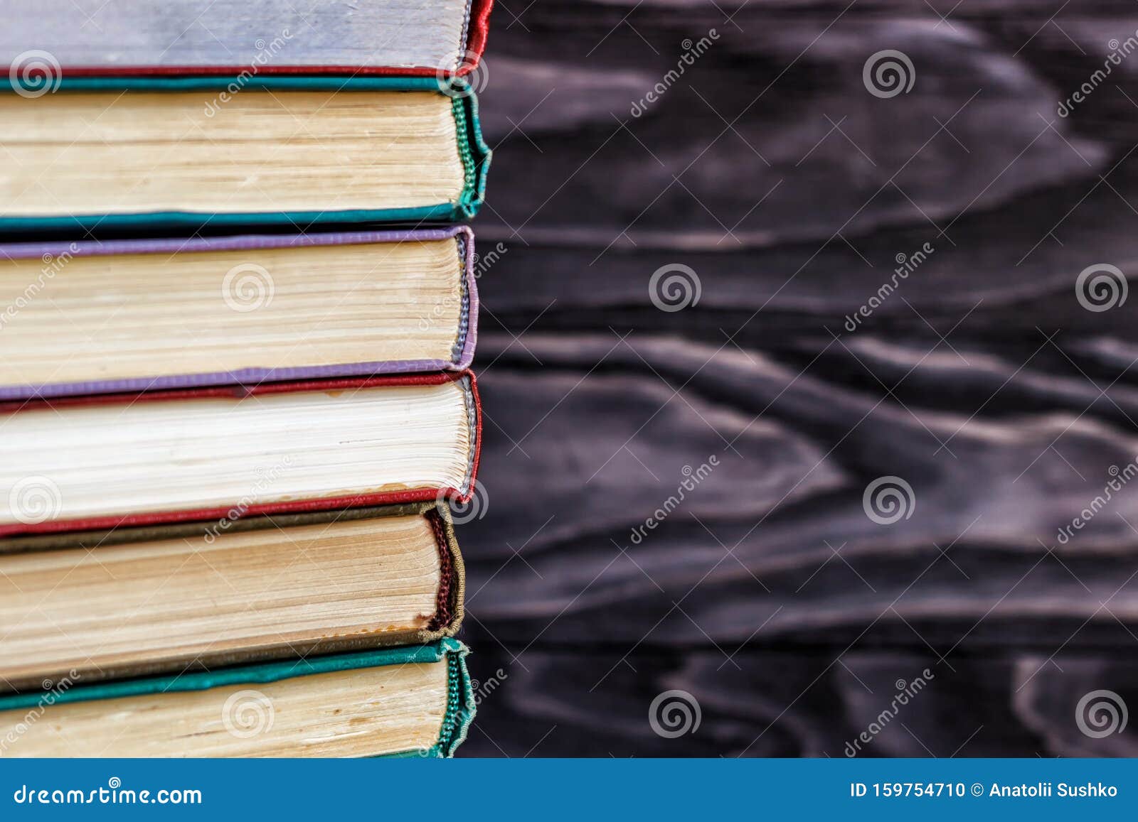 Stacks of Colored Books on a Wooden Table. Concept of Reading Habits ...