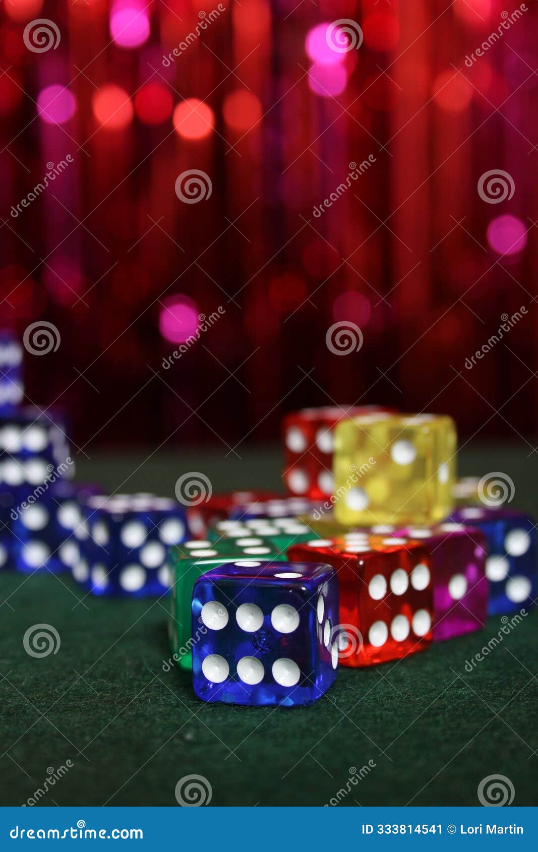 Stacks of Colorful Dice on Green Felt with Bokeh Background Stock Image ...